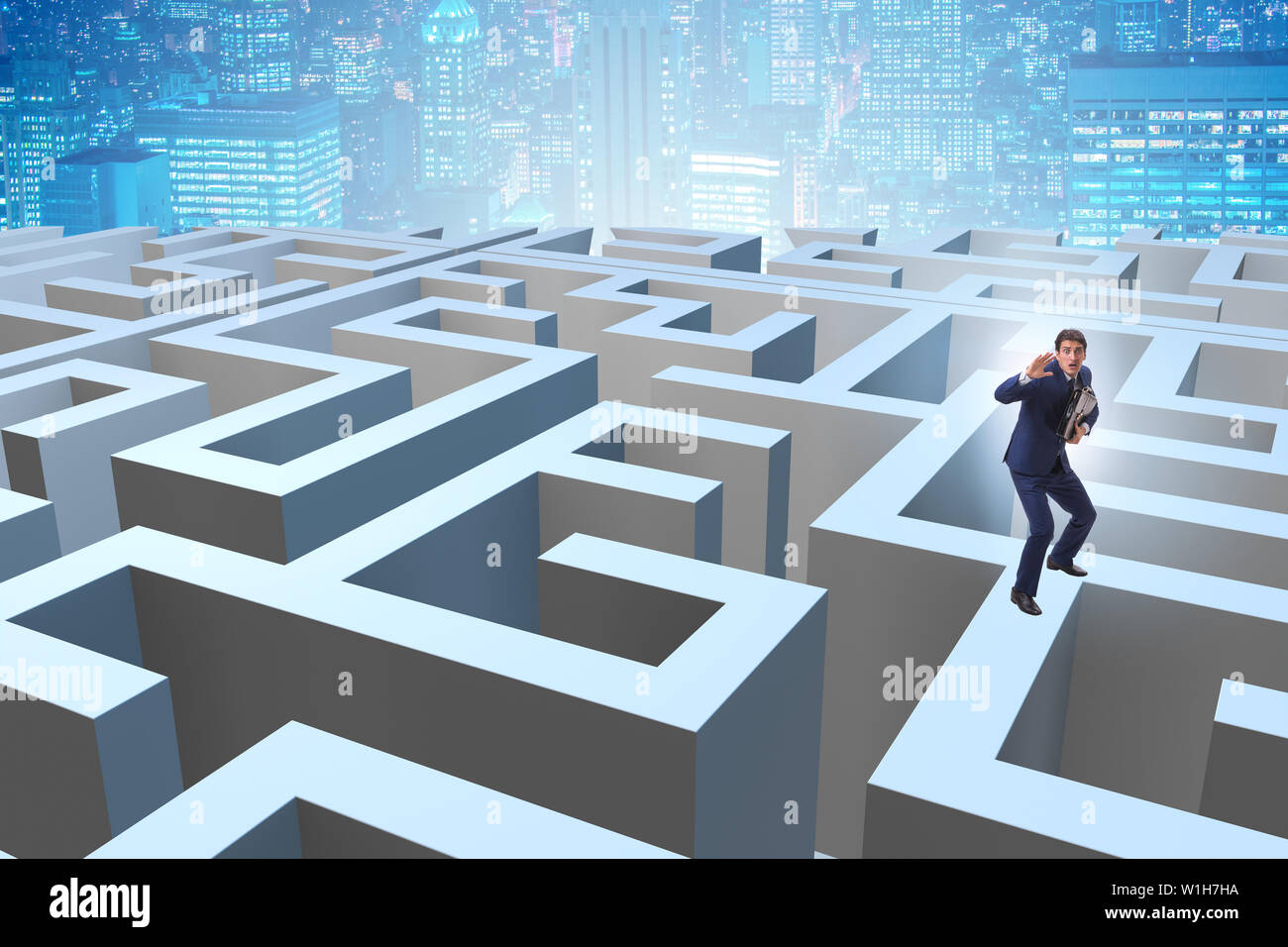 Businessman trying to escape from maze Stock Photo - Alamy