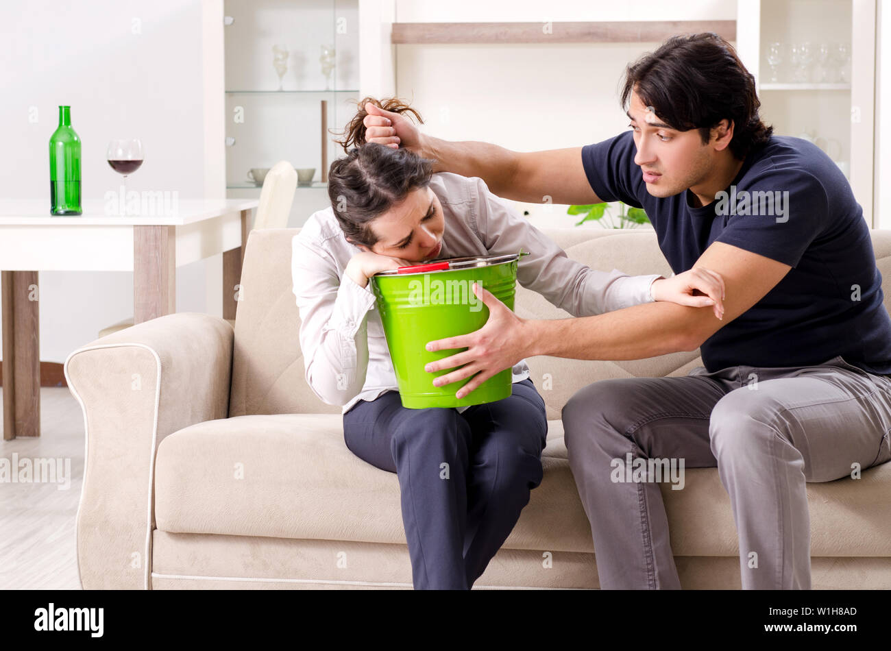 Young wife suffering from sick stomach and vomiting Stock Photo - Alamy
