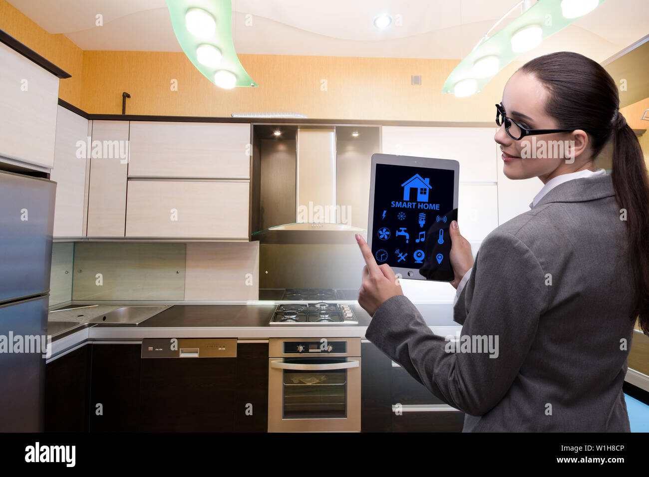 Smart home concept with woman Stock Photo - Alamy