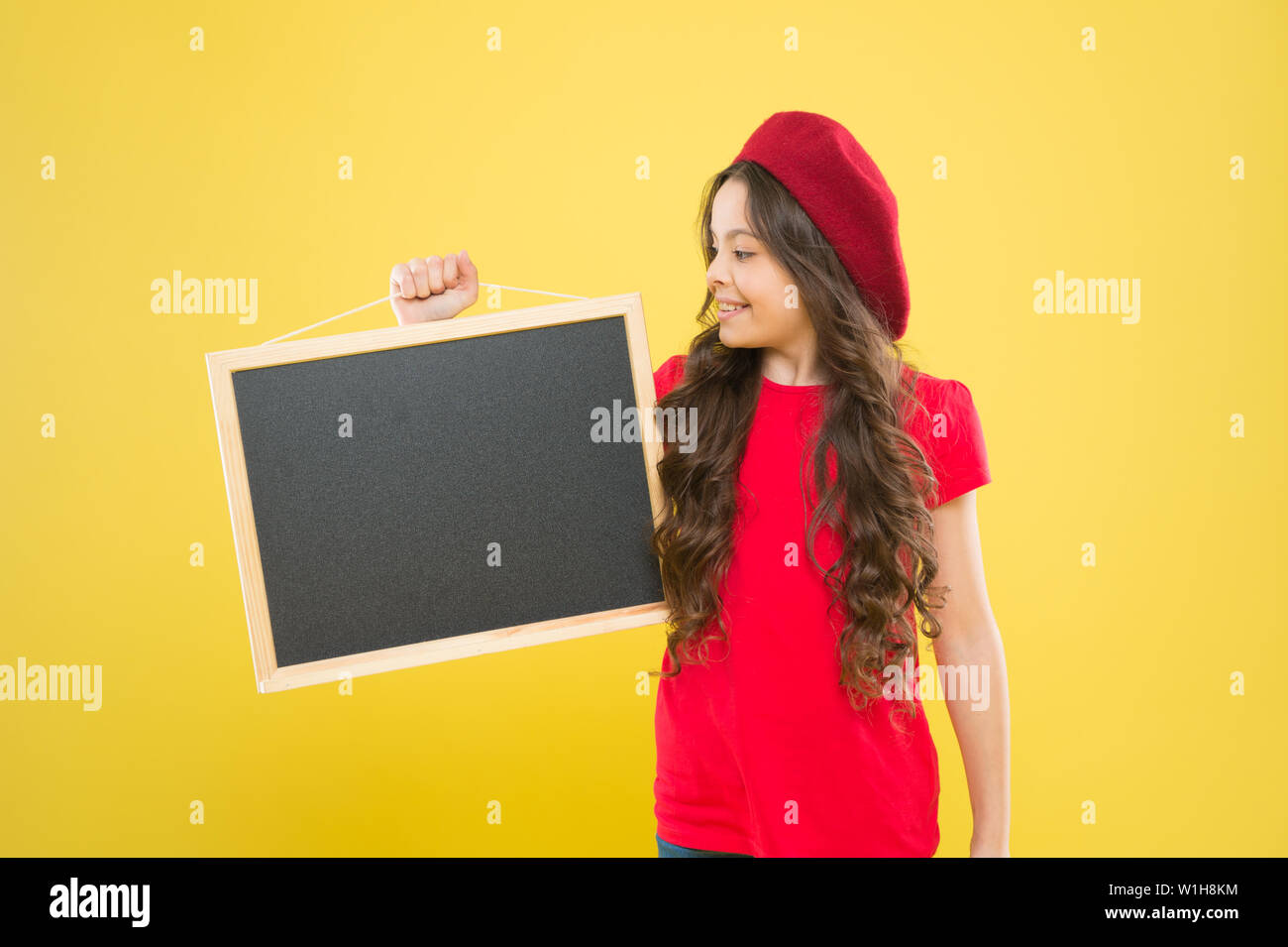 happy school girl in parisian beret. little girl kid with backboard ...