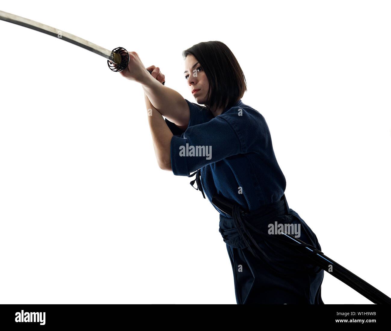 one caucasian woman practicing laido Katori Shinto ryu shadow ...