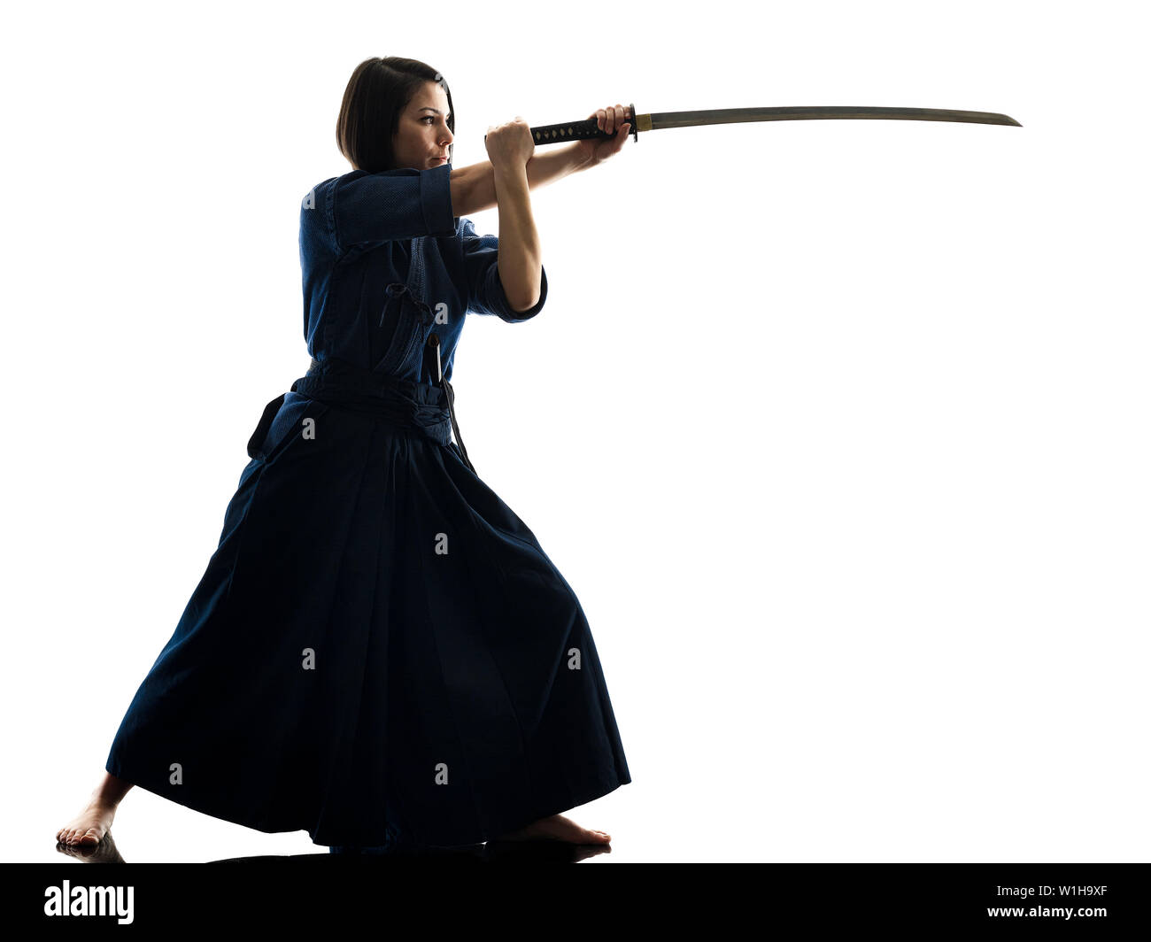 one caucasian woman practicing laido Katori Shinto ryu shadow ...