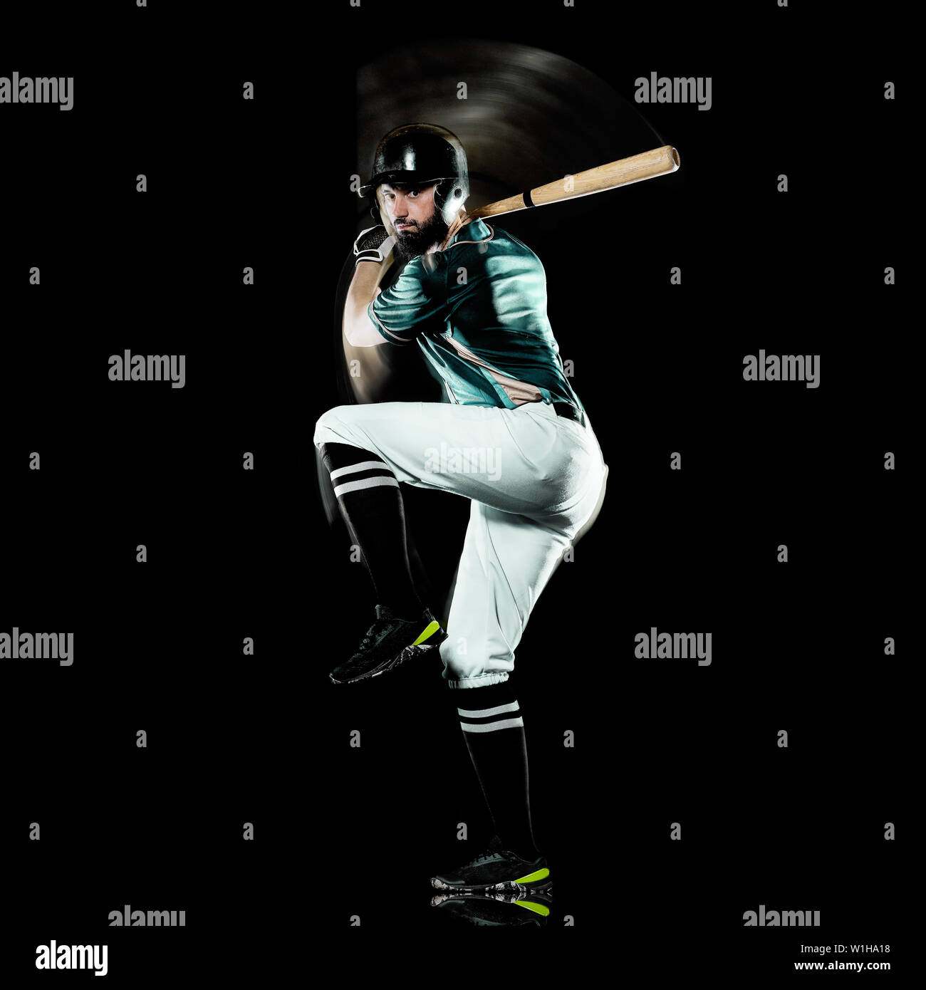 one caucasian baseball player man studio shot isolated on black ...