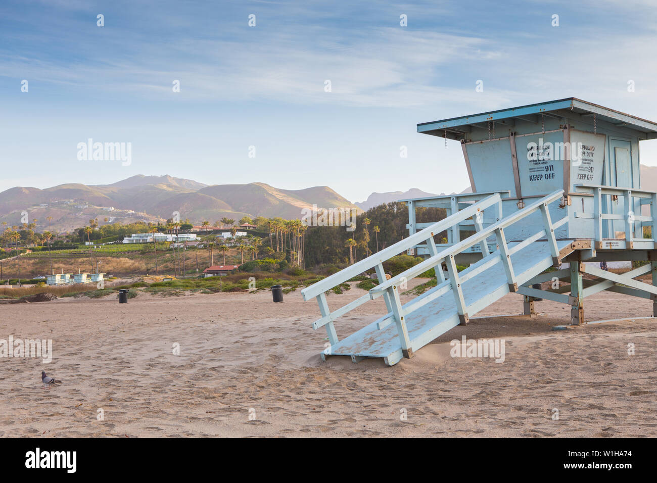 Empty Lifeguard tower marked with a sign saying, Lifeguard off duty ...