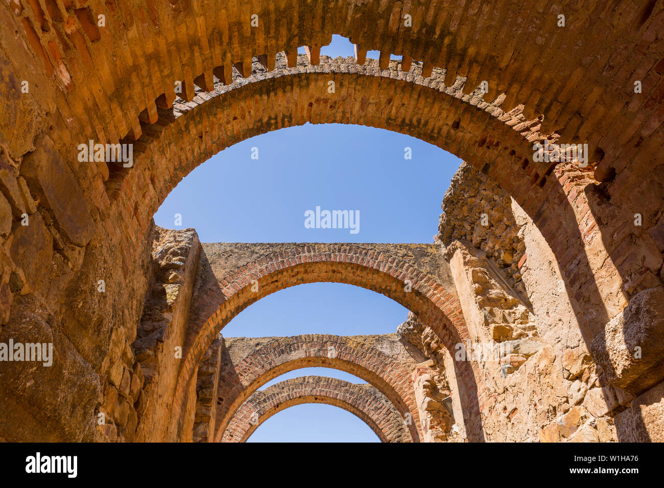 Exit gateway with arches of Roman Amphitheater, at the huge ...
