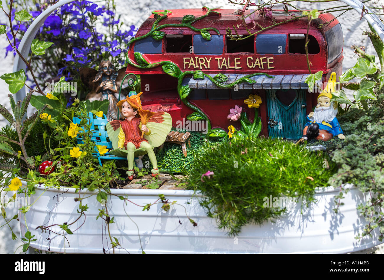 potted Miniature fairy garden on a patio with a miniature red London ...