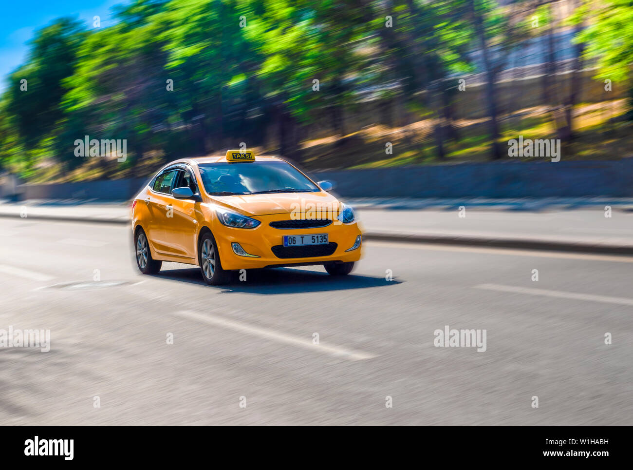 Ankara/Turkey-June 23 2019: One yellow taxi (cab) on the way and green ...