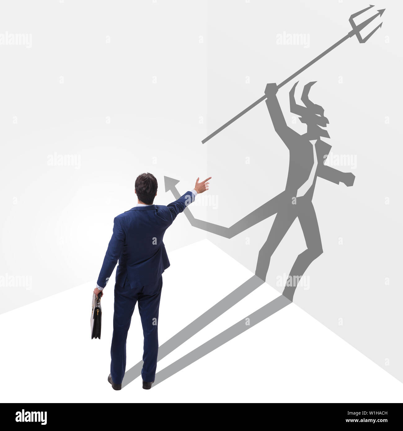 Devil hiding in the businessman - alter ego concept Stock Photo - Alamy