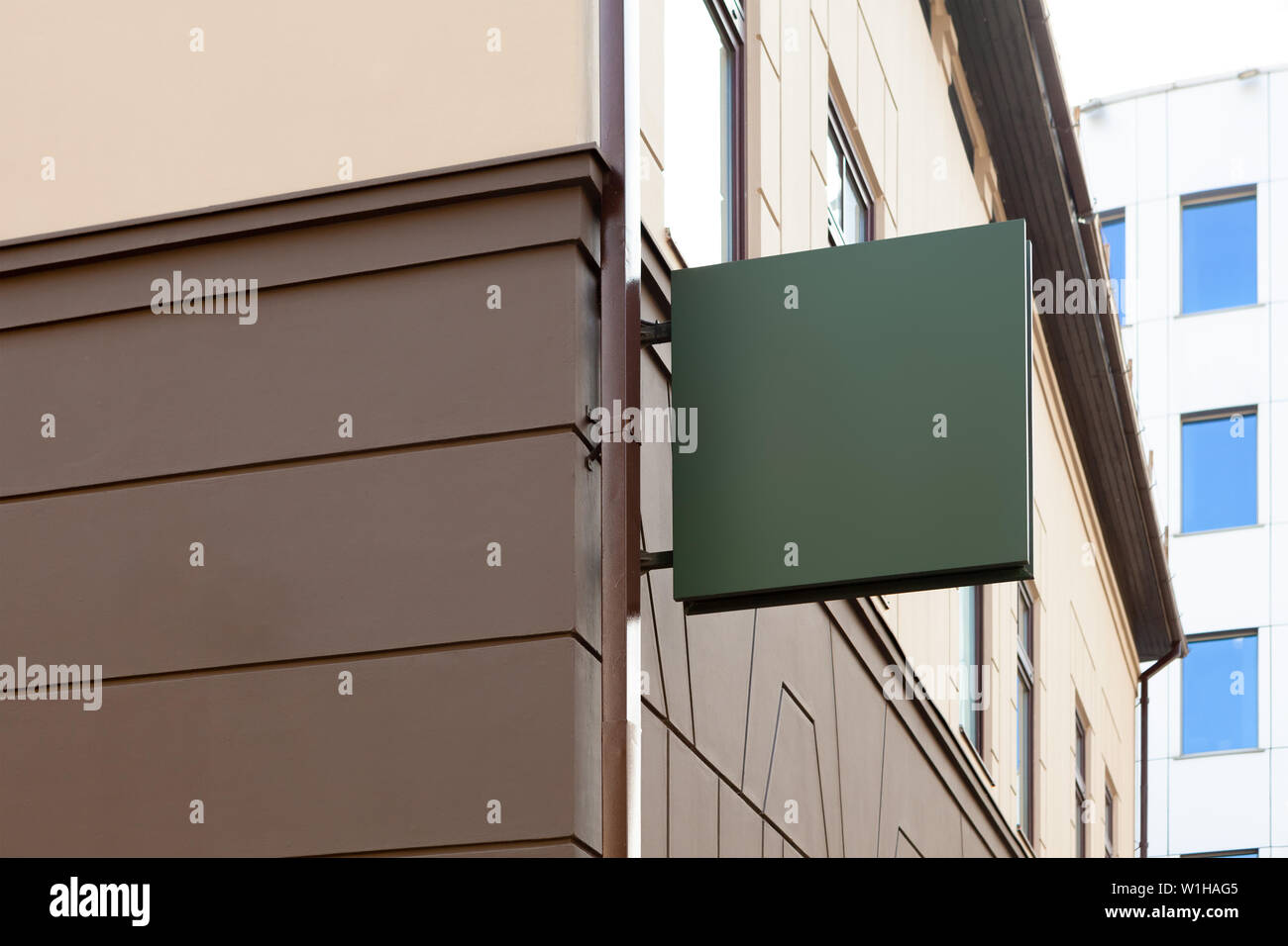 Blank green square outdoor business signage mock up Stock Photo - Alamy