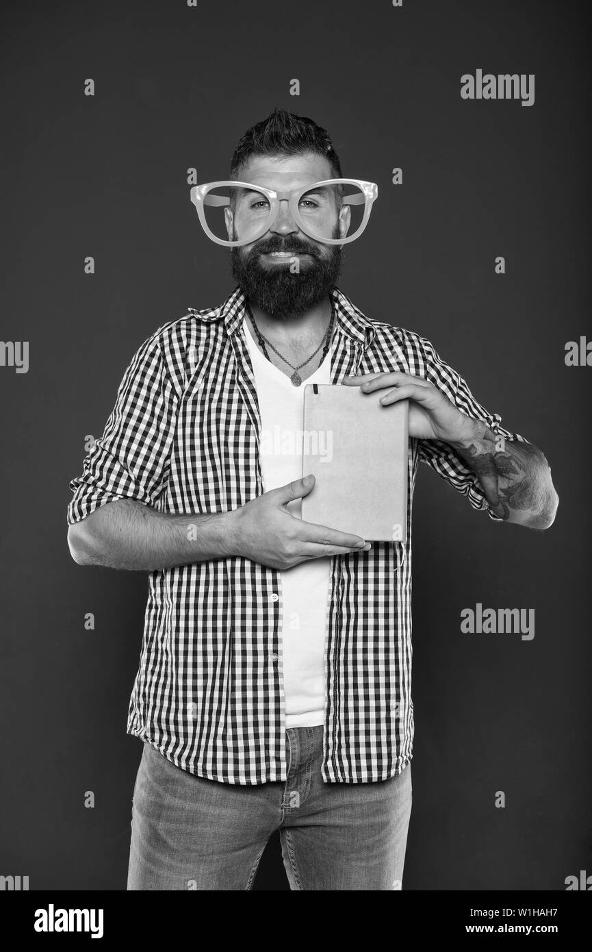 Bookworm. Book nerd wearing fancy glasses. Study nerd holding book ...