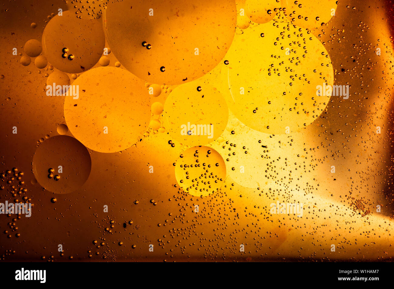 Oil bubbles inside water base form patterns Stock Photo - Alamy