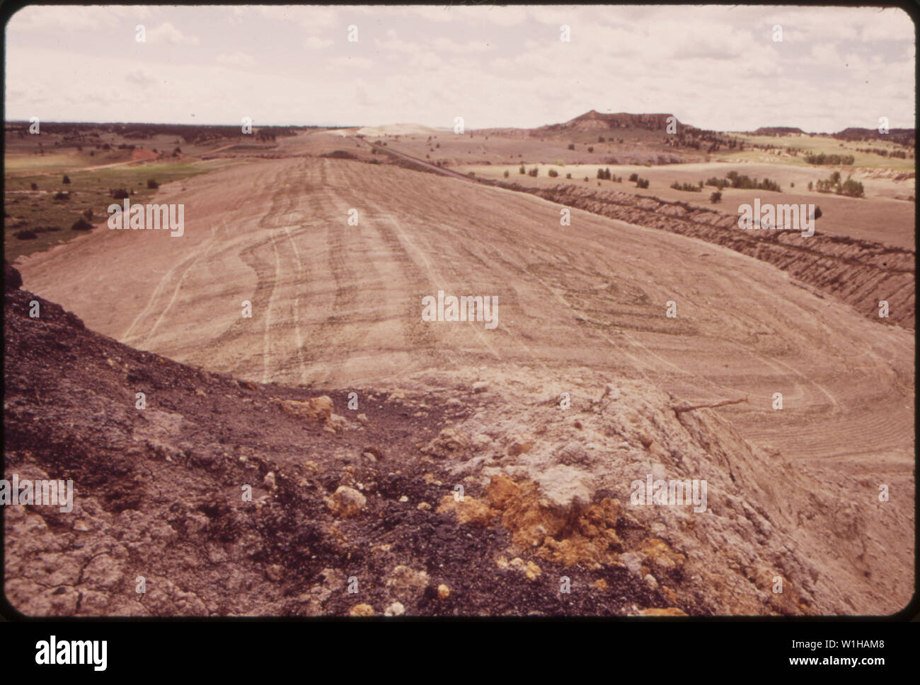 OLD SPOIL PILES ARE FLATTENED AND PLANTED IN AN ATTEMPT AT RECLAMATION ...