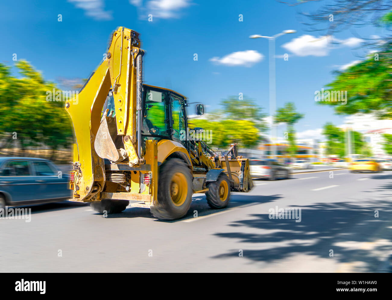 White excavator drives on construction hi-res stock photography and ...