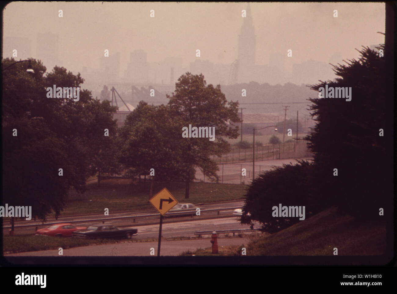 ON JULY 20, 1973--DAY OF A POLLUTION ALERT--CLEVELAND SKYLINE IS BARELY ...