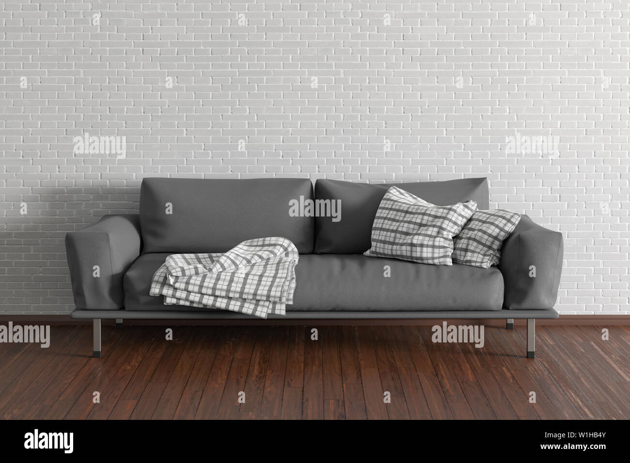 Grey leather couch in interior of living room with wooden flooring and ...