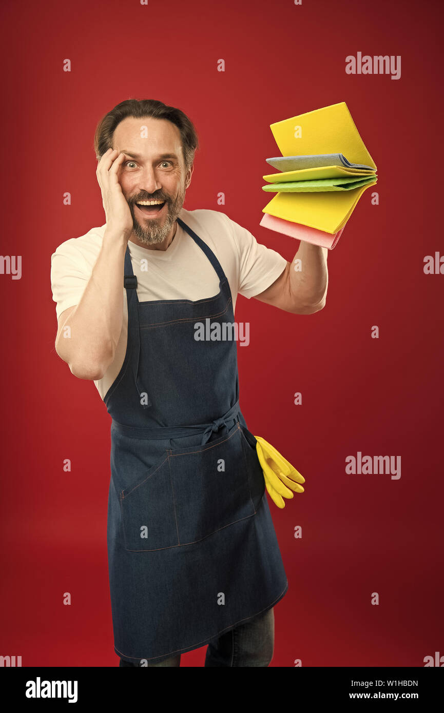 Cleaning service and household duty. Man in apron with gloves hold ...