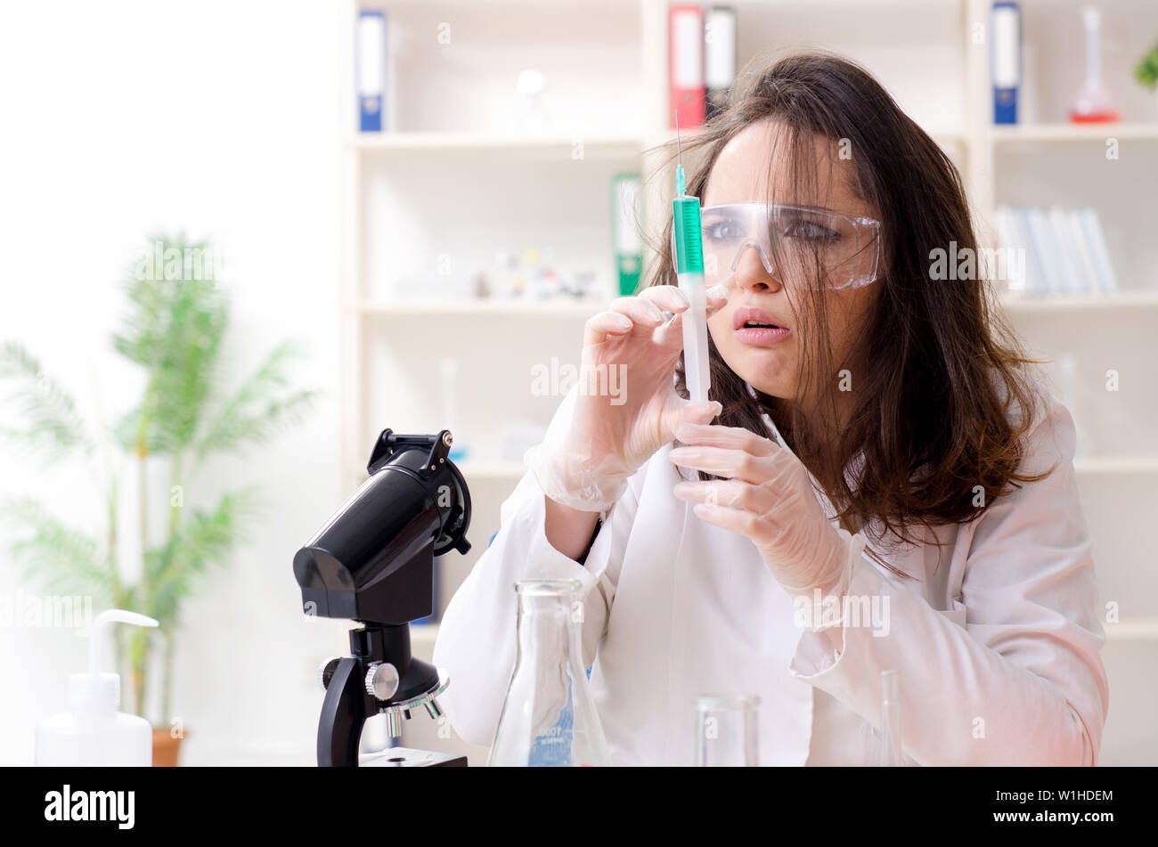Funny female chemist working in the lab hi-res stock photography and ...