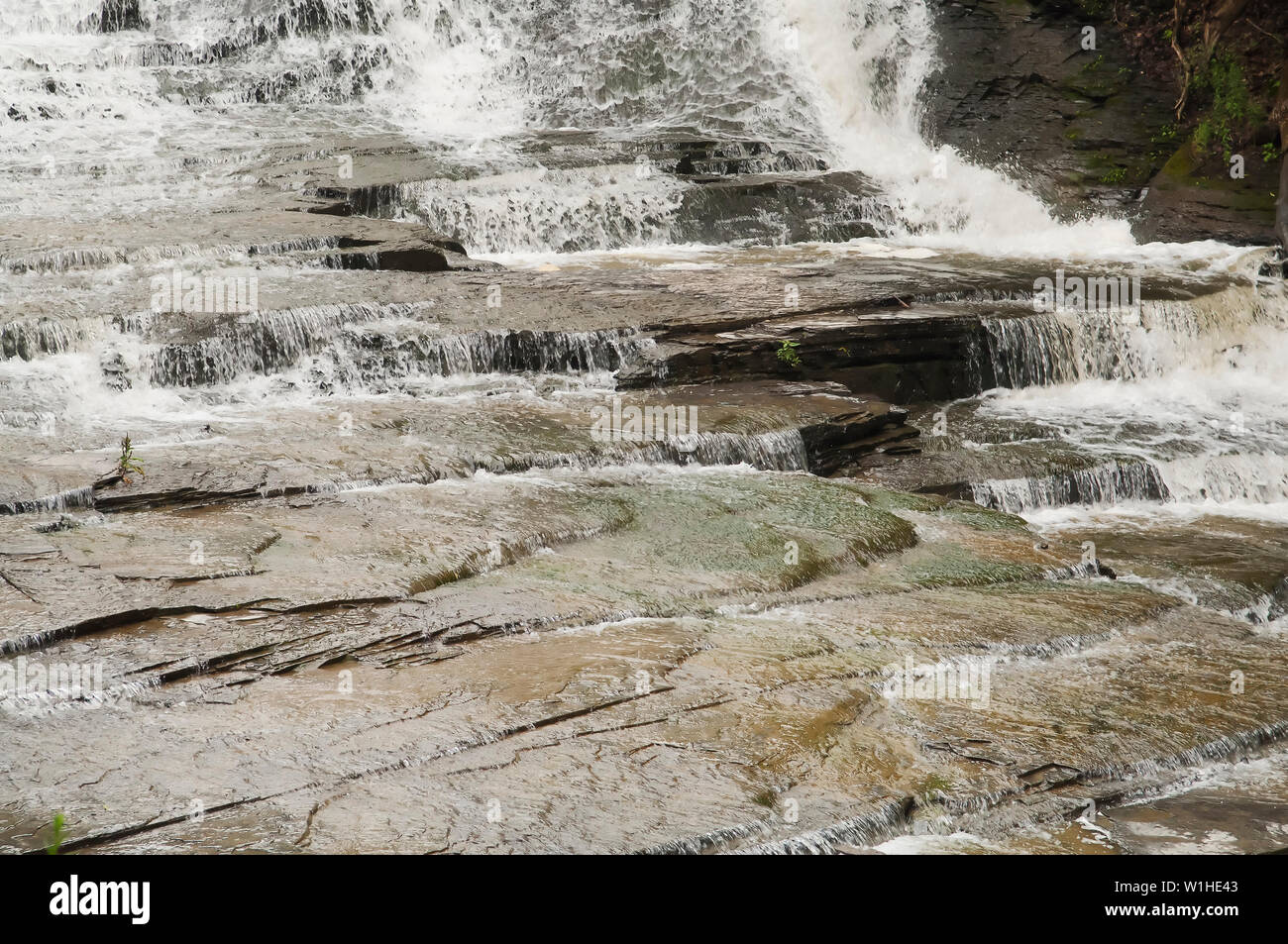 Whitewater flowing over rocks in a river Stock Photo - Alamy