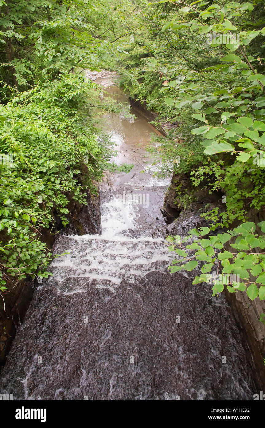 A small waterfall and cascading rapids over rocks Stock Photo - Alamy