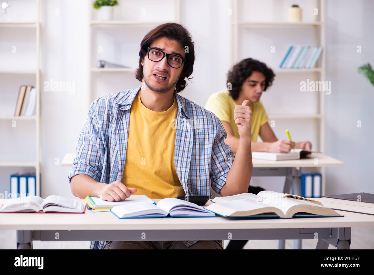 Two male students in the classroom Stock Photo - Alamy