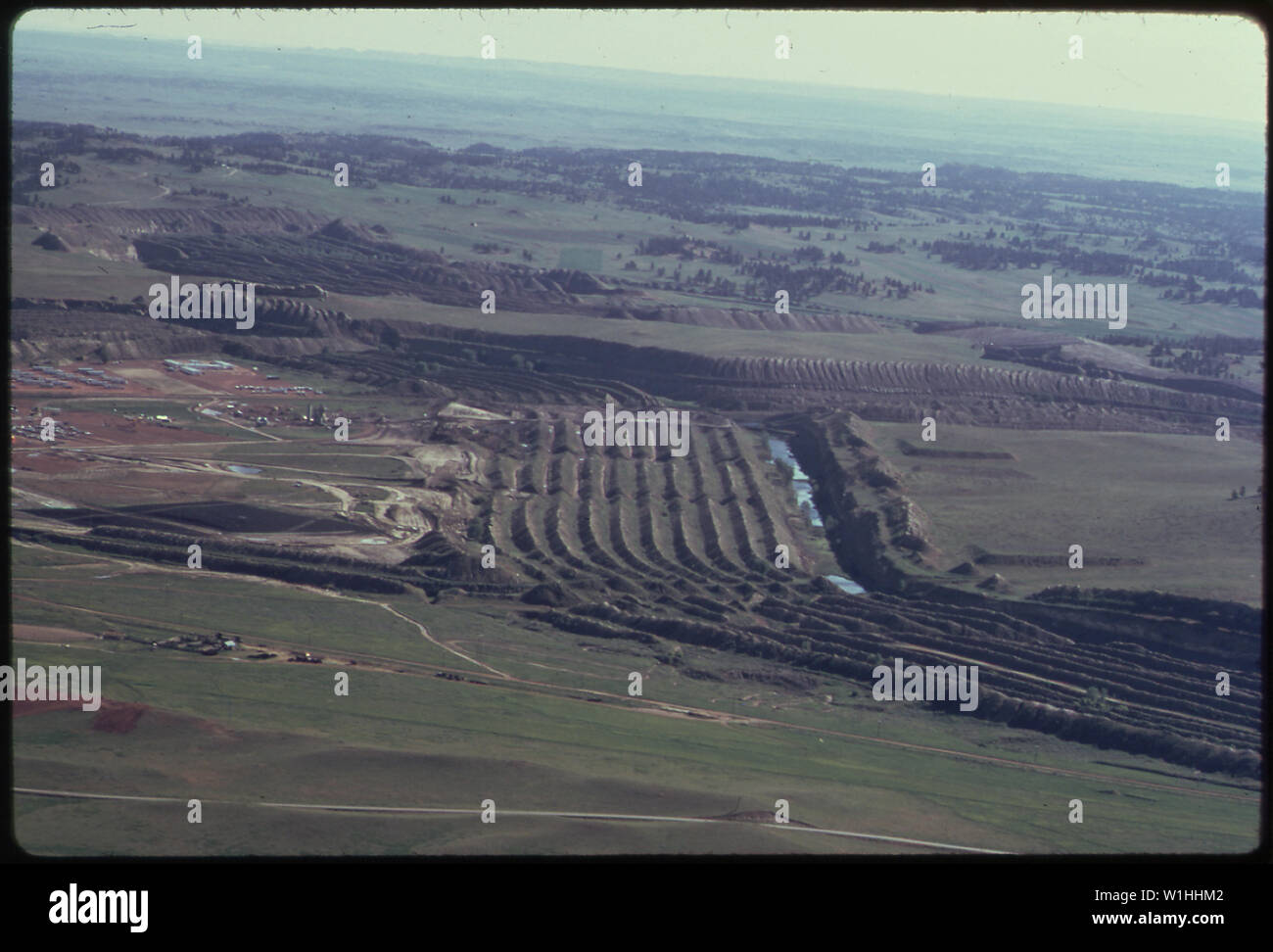POWER PLANT UNDER CONSTRUCTION ALONGSIDE OLD SPOIL PILES LEFT BY ...