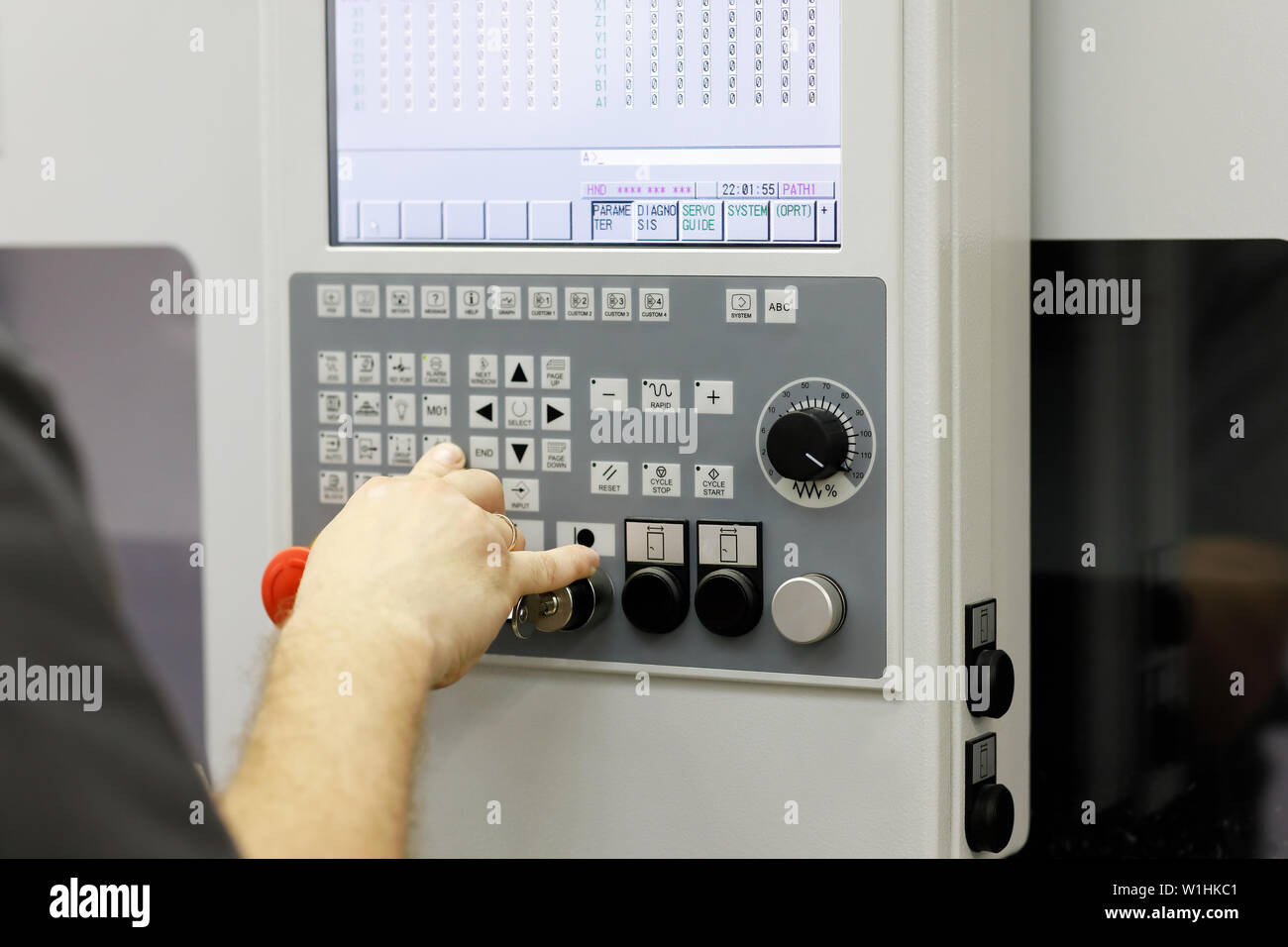 setting up parameters of CNC machining center using control panel Stock ...