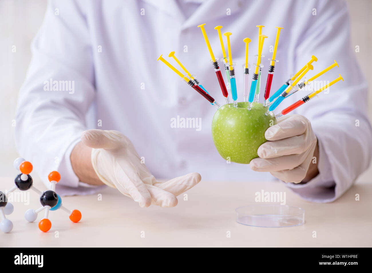 Male nutrition expert testing food products in lab Stock Photo - Alamy