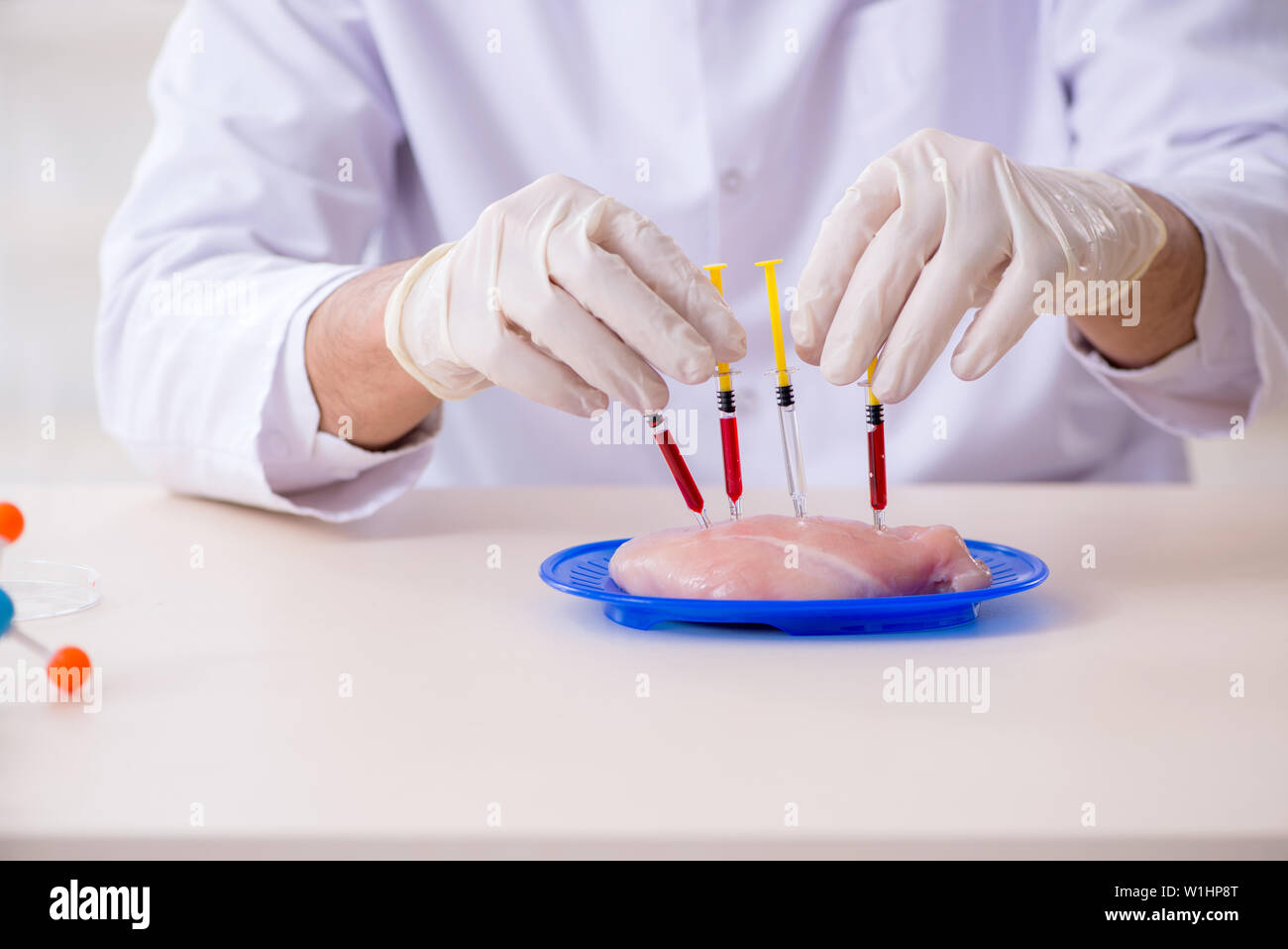 Male nutrition expert testing food products in lab Stock Photo - Alamy