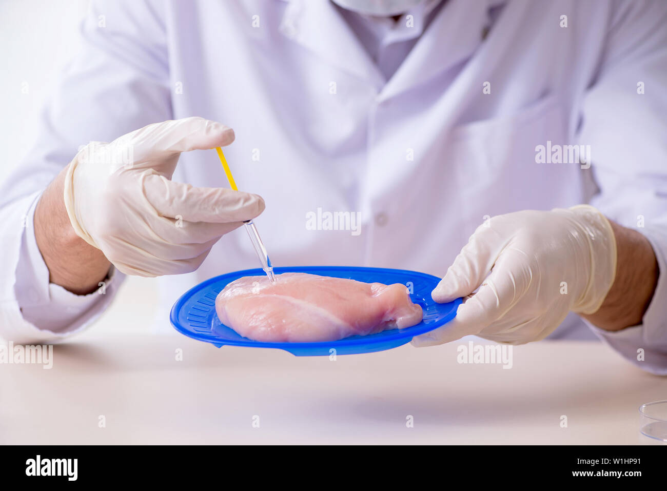 Male nutrition expert testing food products in lab Stock Photo - Alamy