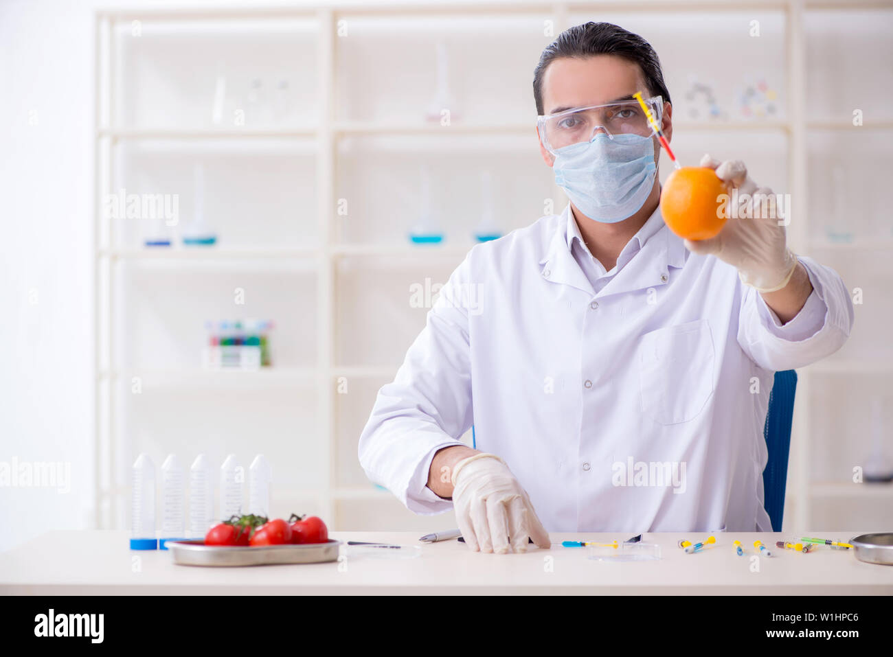 Male nutrition expert testing food products in lab Stock Photo - Alamy