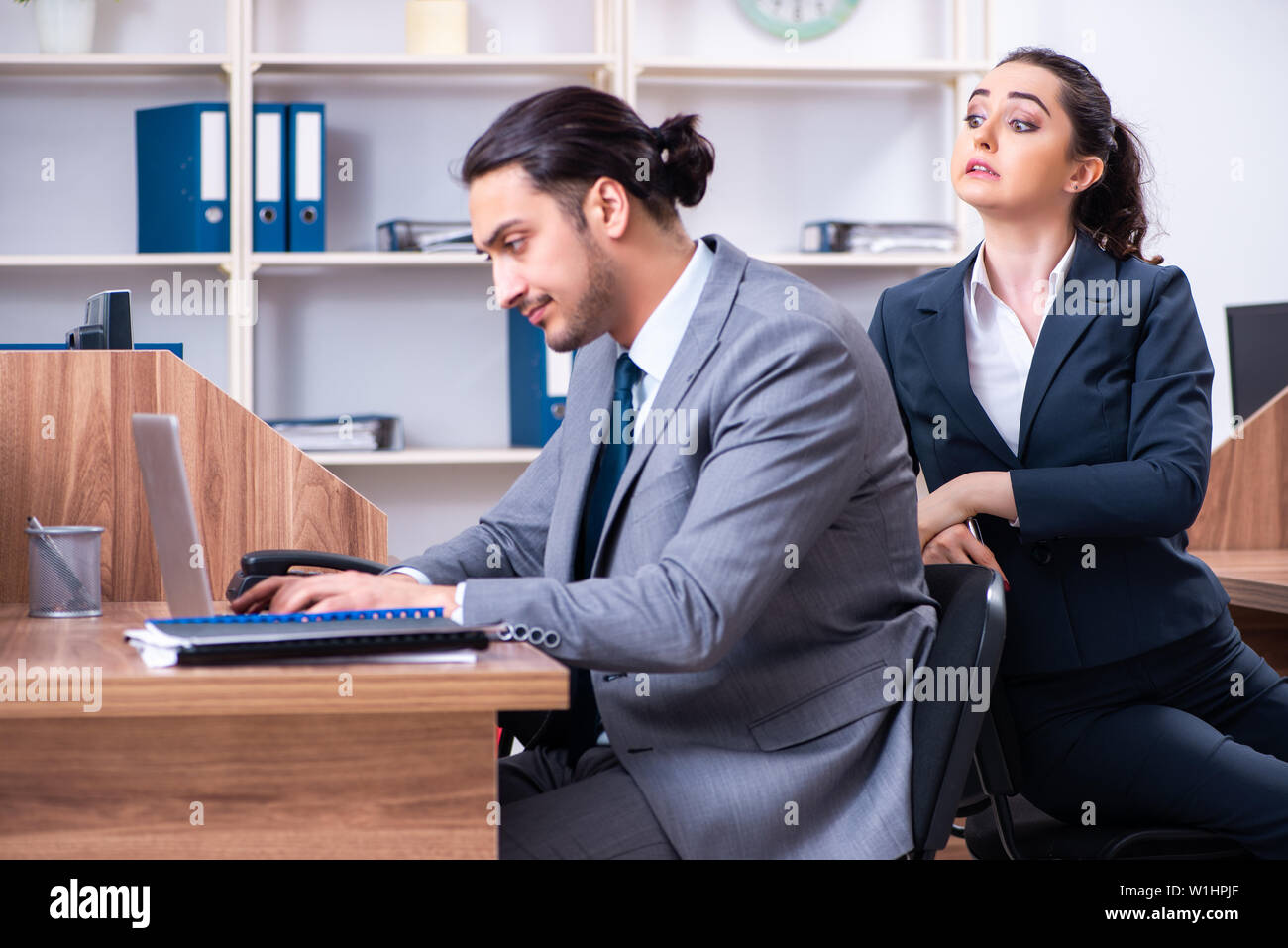 Two employees working in the office Stock Photo - Alamy