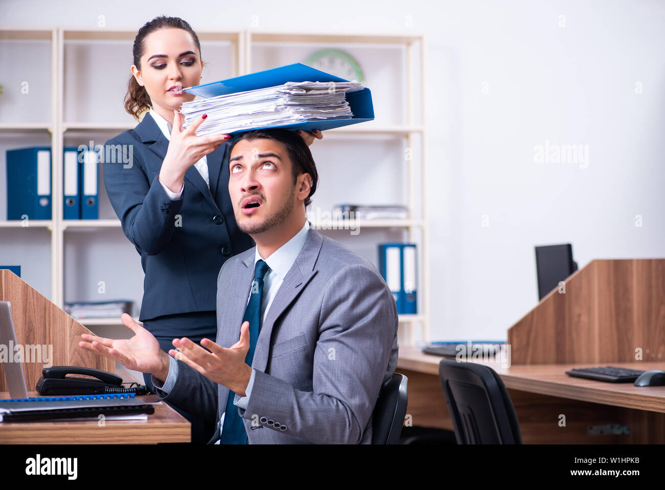 Two employees working in the office Stock Photo - Alamy