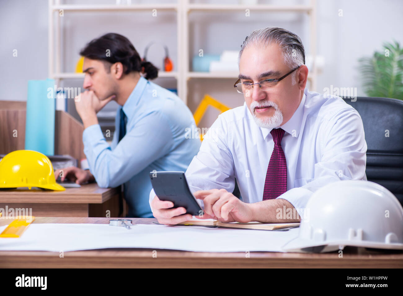 Two architects working on the project Stock Photo - Alamy