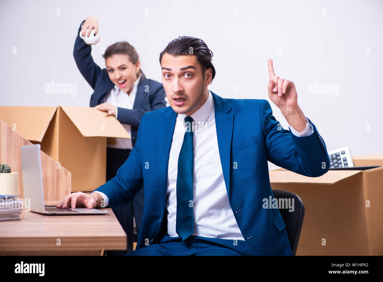 Two employees being fired from their work Stock Photo - Alamy