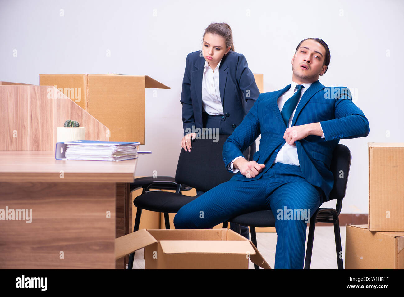 Two employees being fired from their work Stock Photo - Alamy