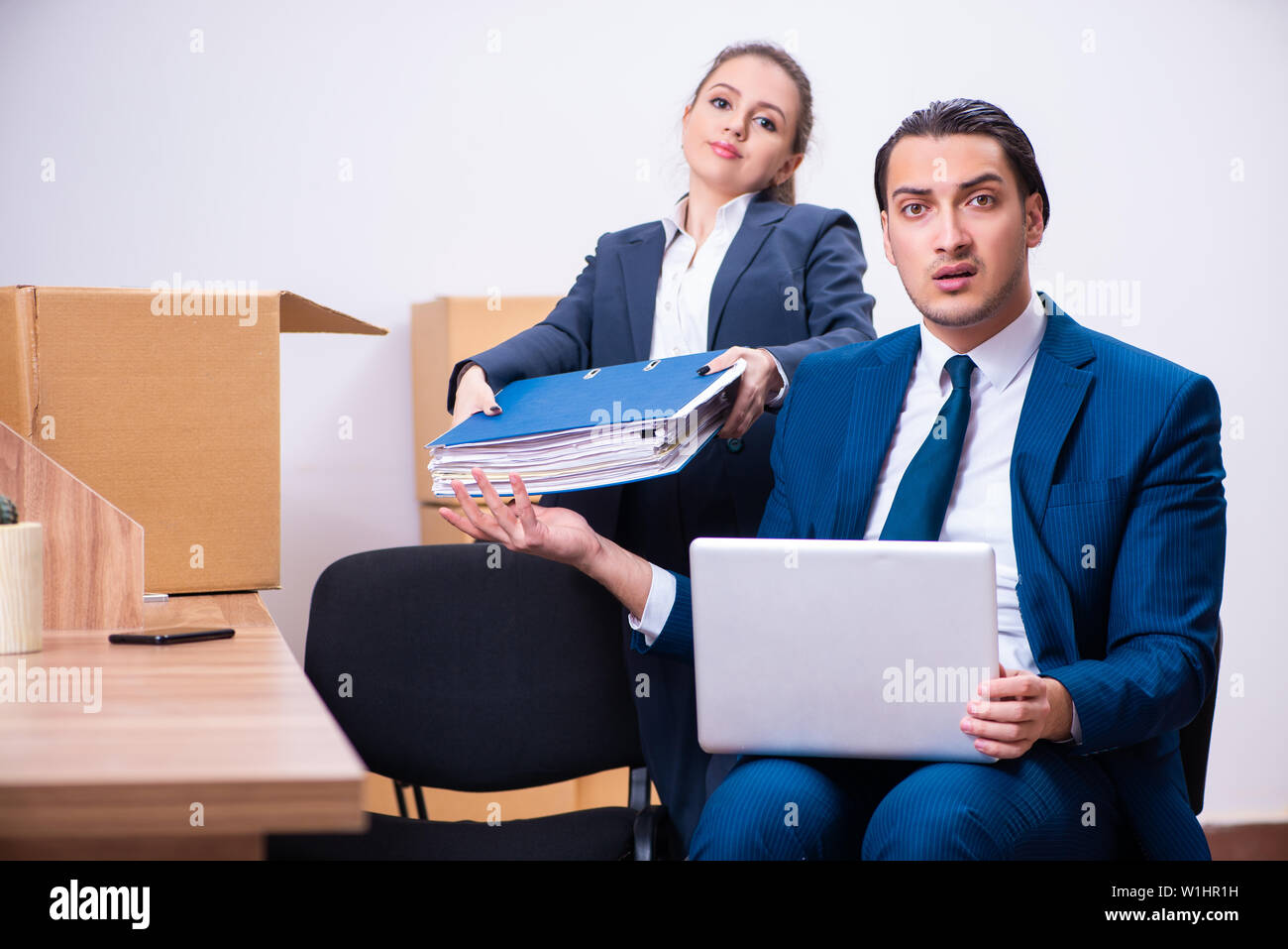Two employees being fired from their work Stock Photo - Alamy
