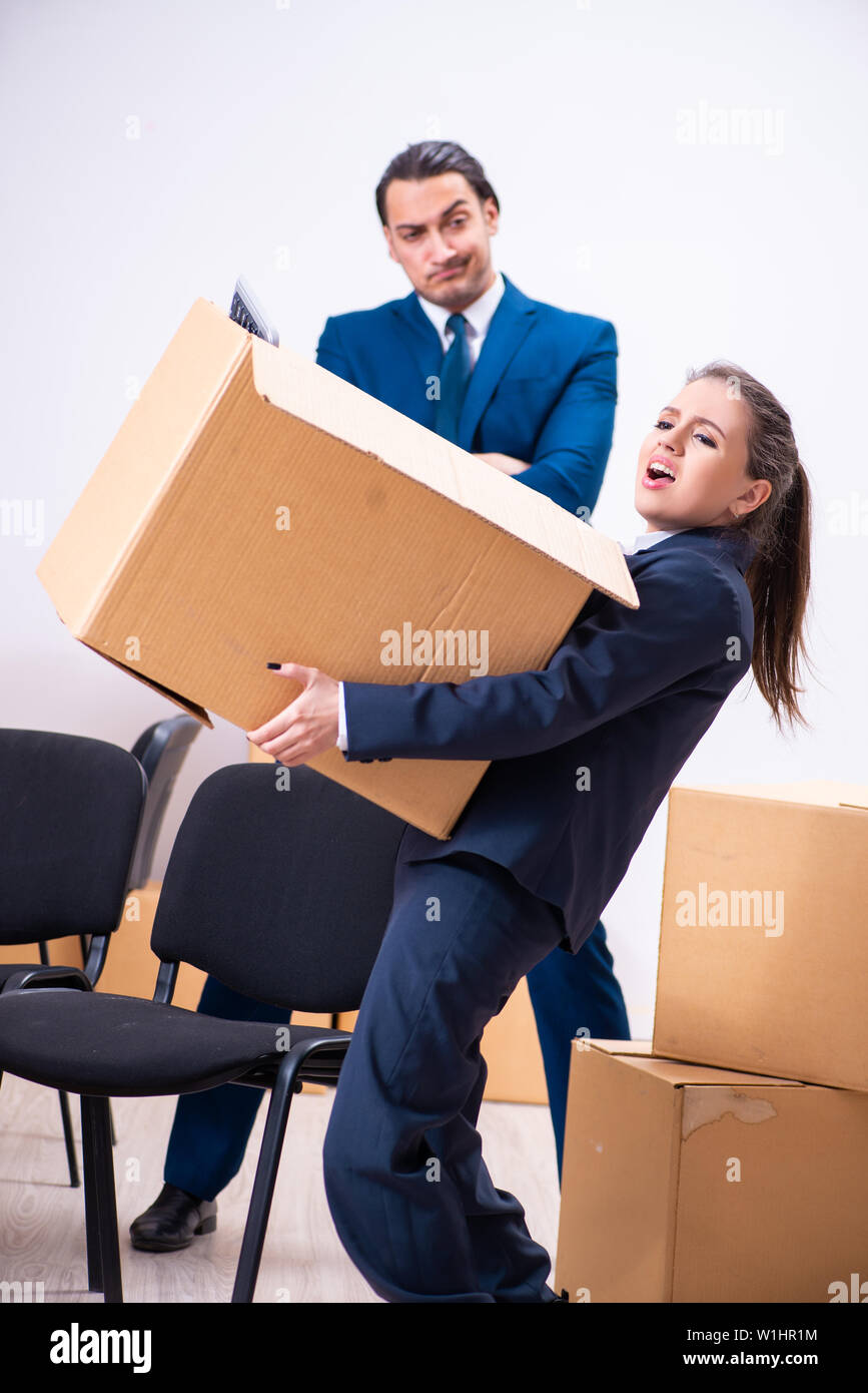 Two employees being fired from their work Stock Photo - Alamy