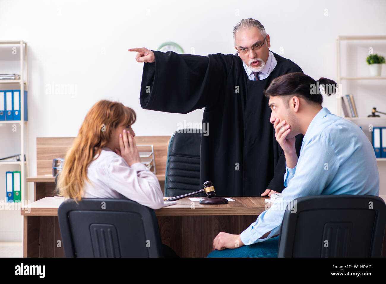 Young couple in the courthouse in divorce concept Stock Photo - Alamy