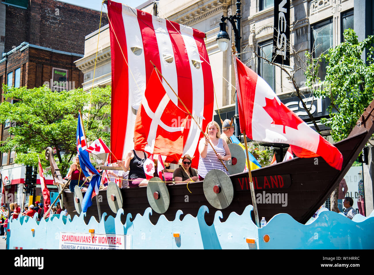 The parade of Canadian National Day in downtown Montreal Stock Photo ...