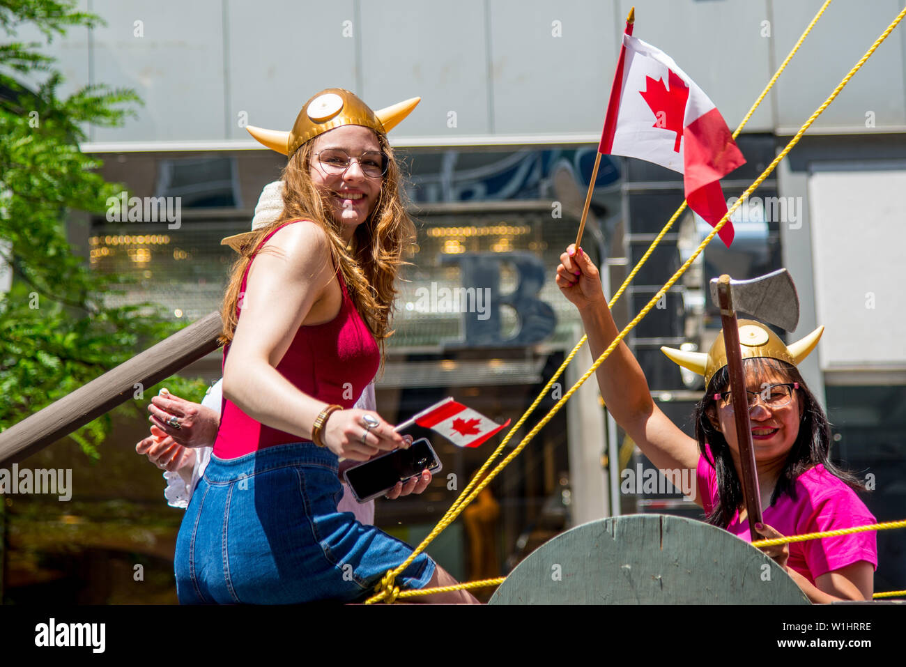 The parade of Canadian National Day in downtown Montreal Stock Photo ...
