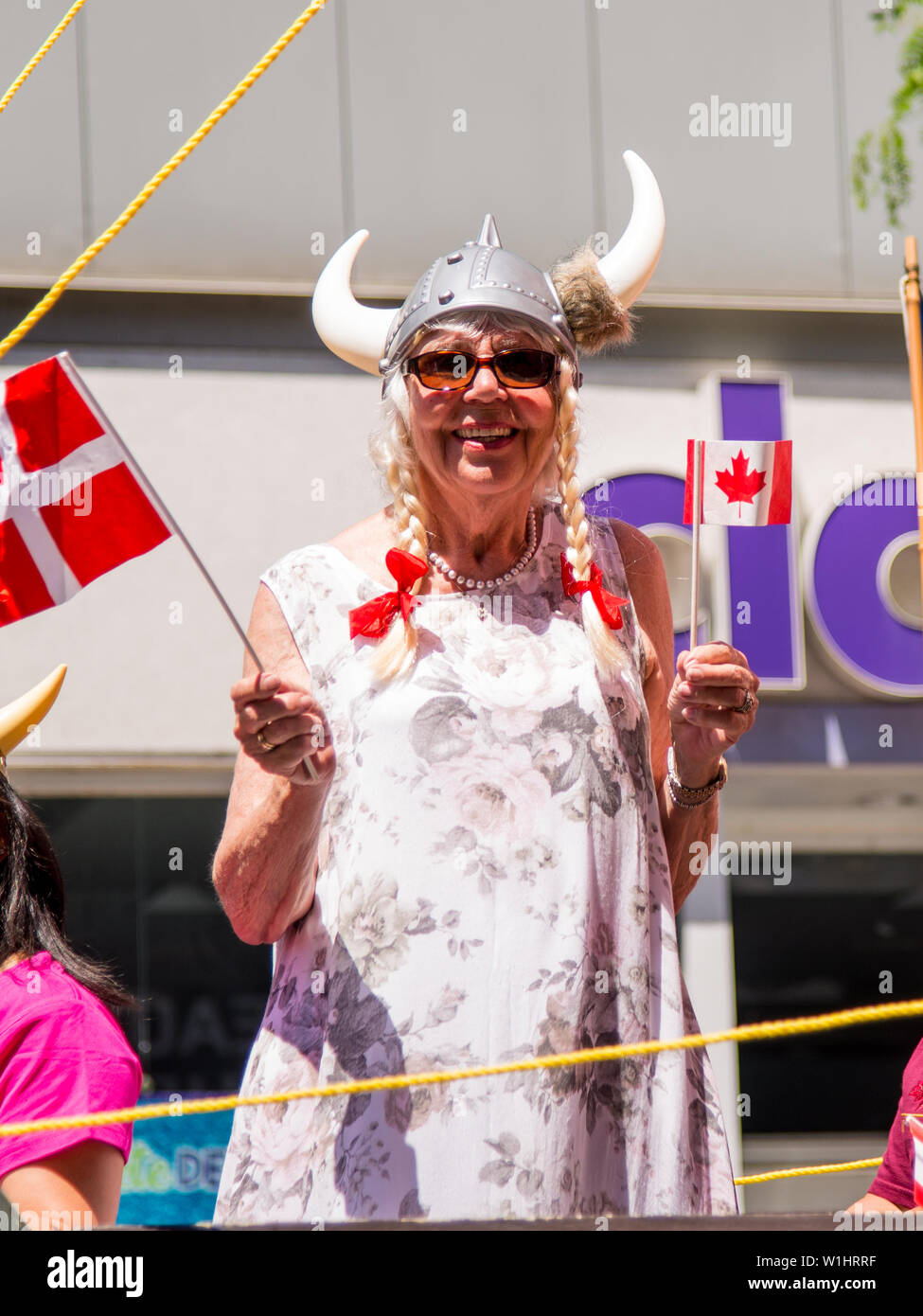 The parade of Canadian National Day in downtown Montreal Stock Photo ...