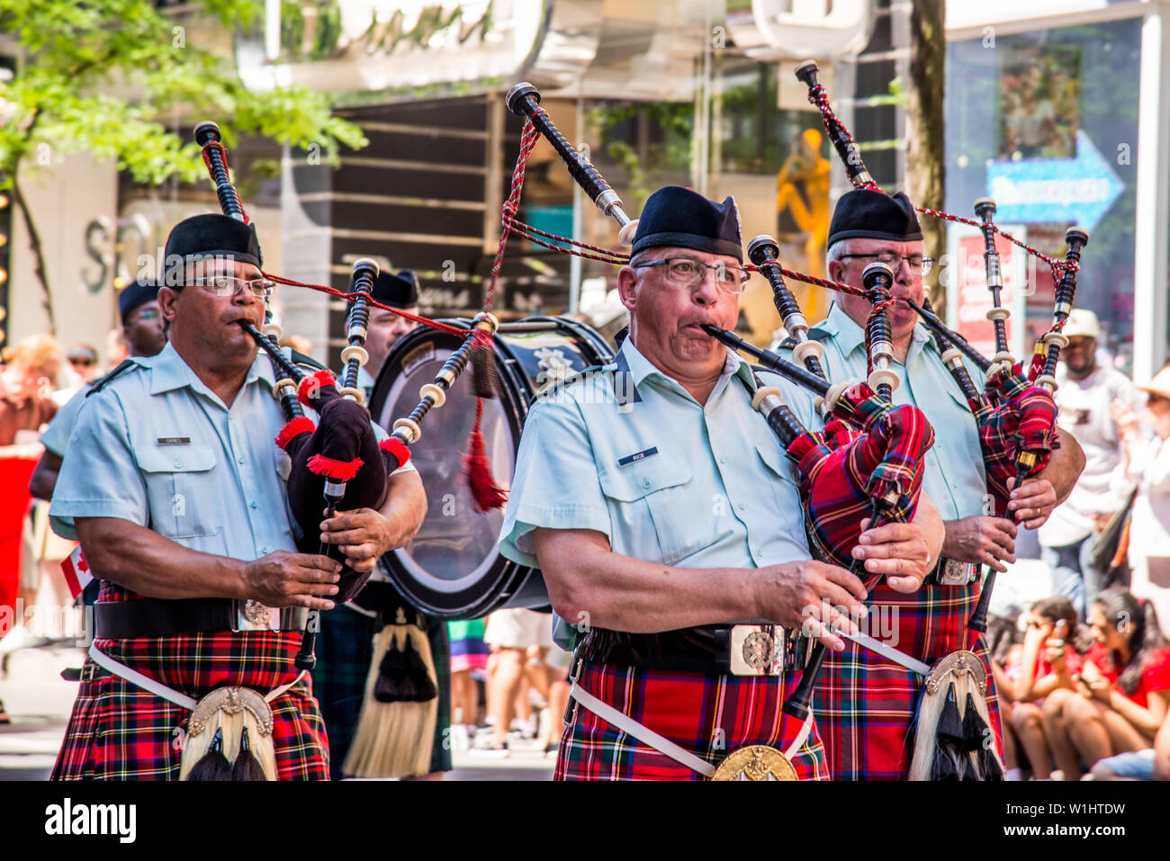 The parade of Canadian National Day in downtown Montreal Stock Photo ...