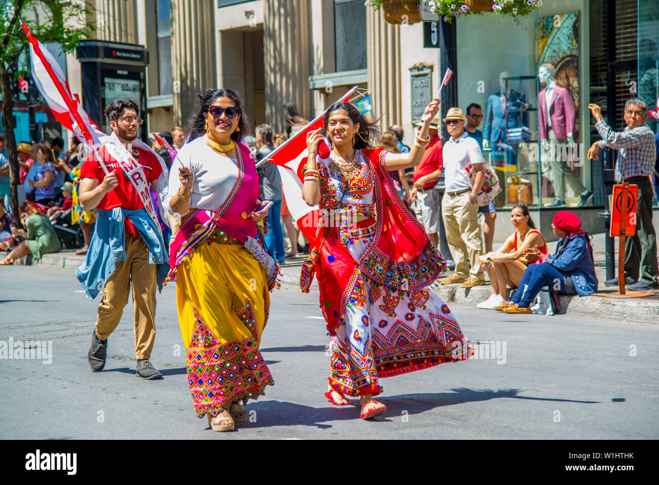 The parade of Canadian National Day in downtown Montreal Stock Photo ...