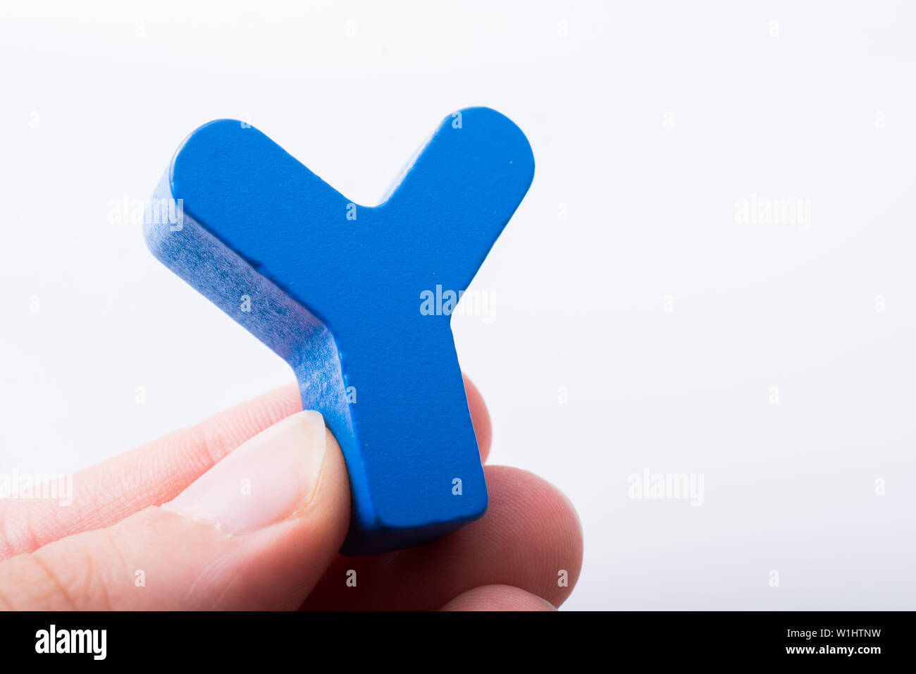 Hand holding letter cube Y of made of wood Stock Photo - Alamy