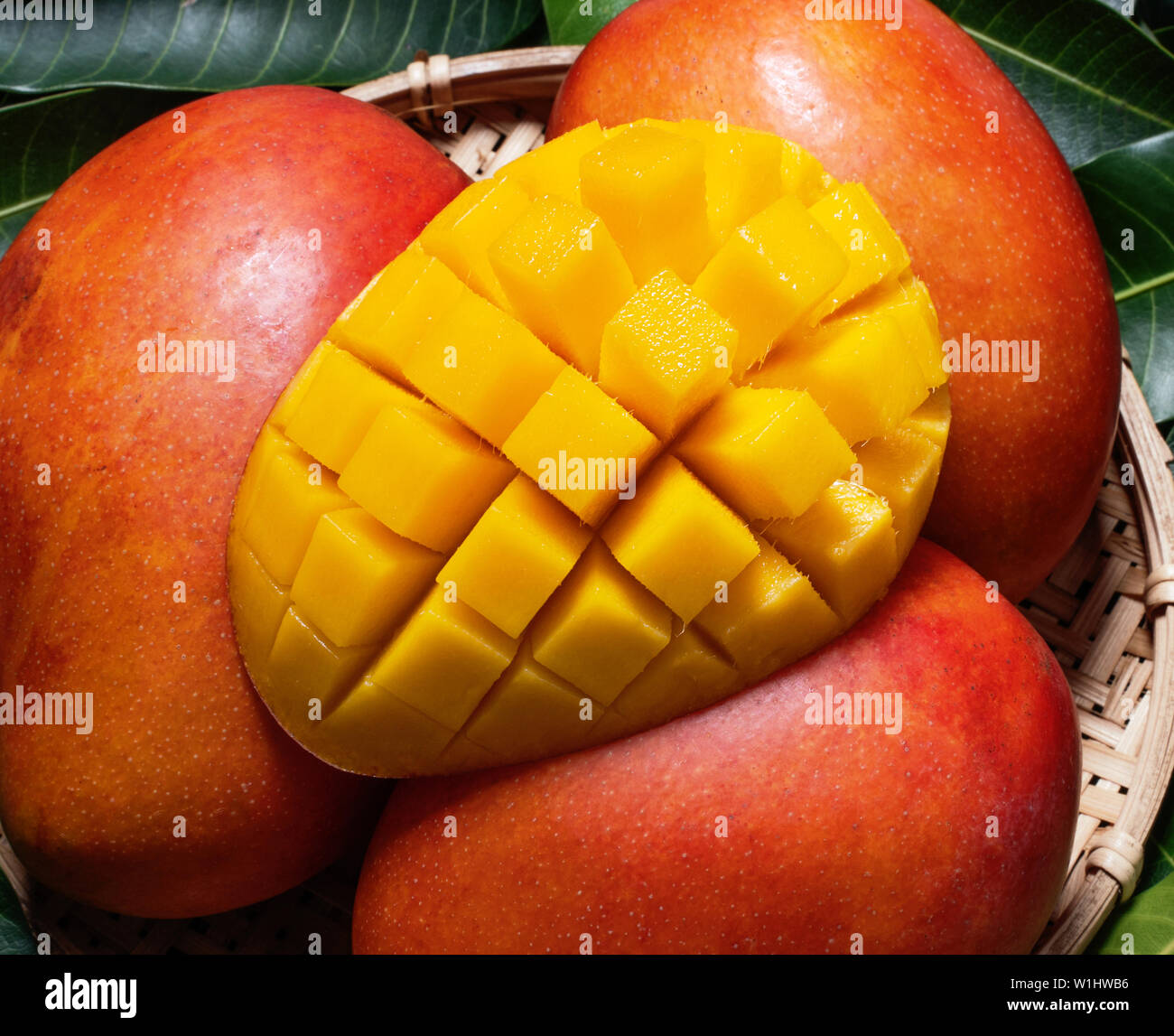 Mango in bamboo basket hi-res stock photography and images - Alamy