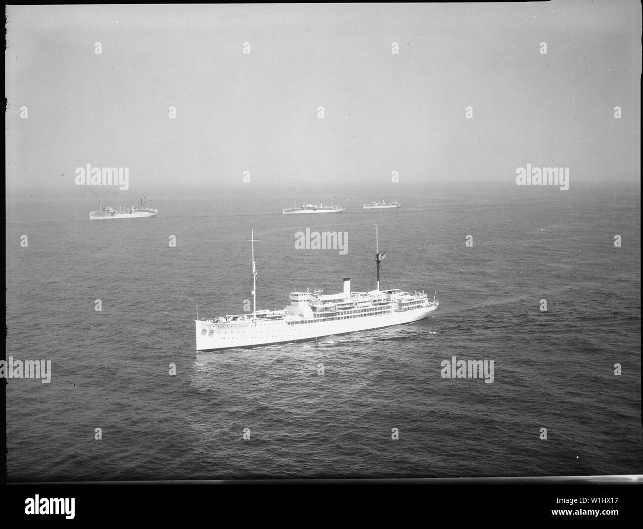 USS Relief (AH1). Hospital ship, Aerial, starboard side, underway Stock ...