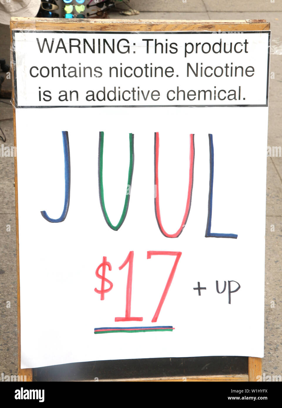 New York City, New York, USA. 2nd July, 2019. A JUUL sign on display in ...