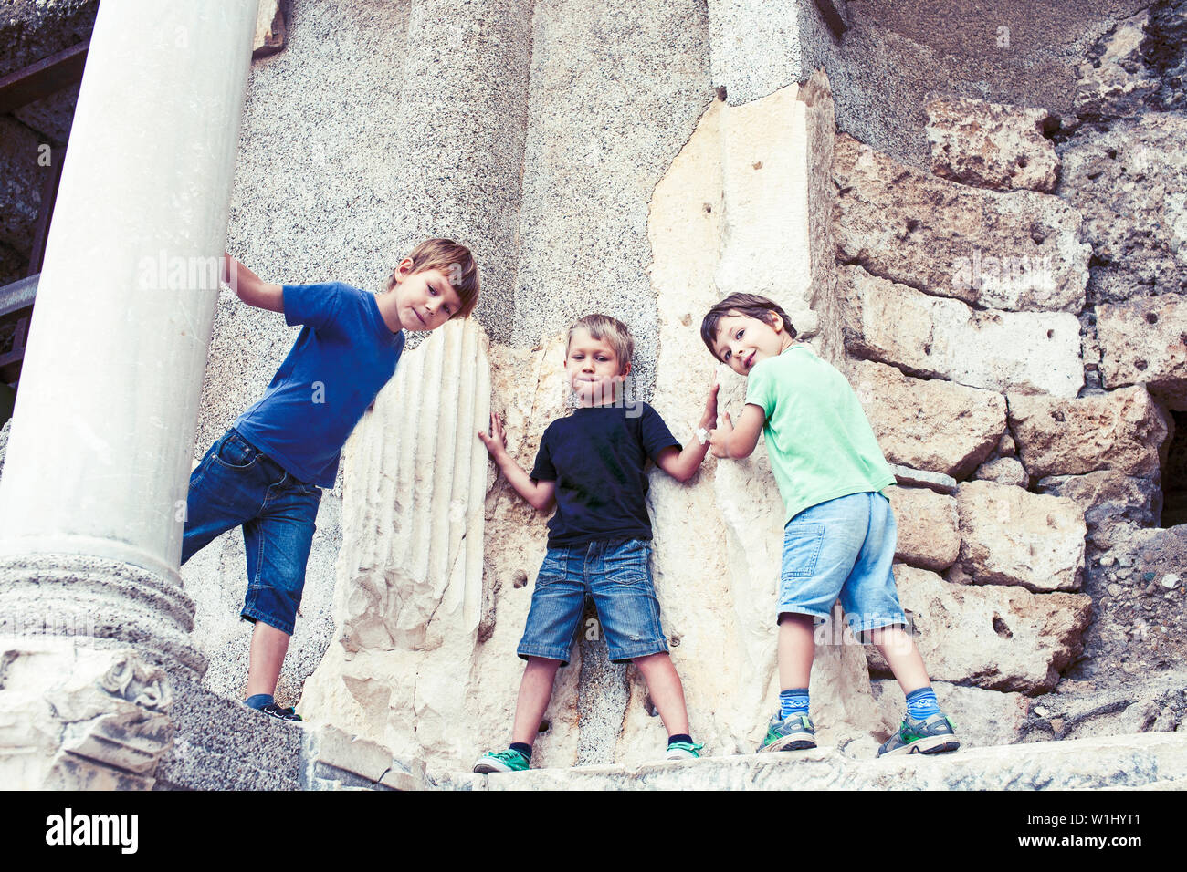little boy exploring ancient architecture, lifestyle people on summer ...