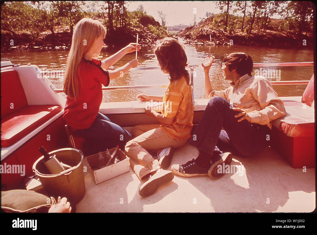 SCHOOL CHILDREN TESTING WATER FOR PURITY Stock Photo - Alamy