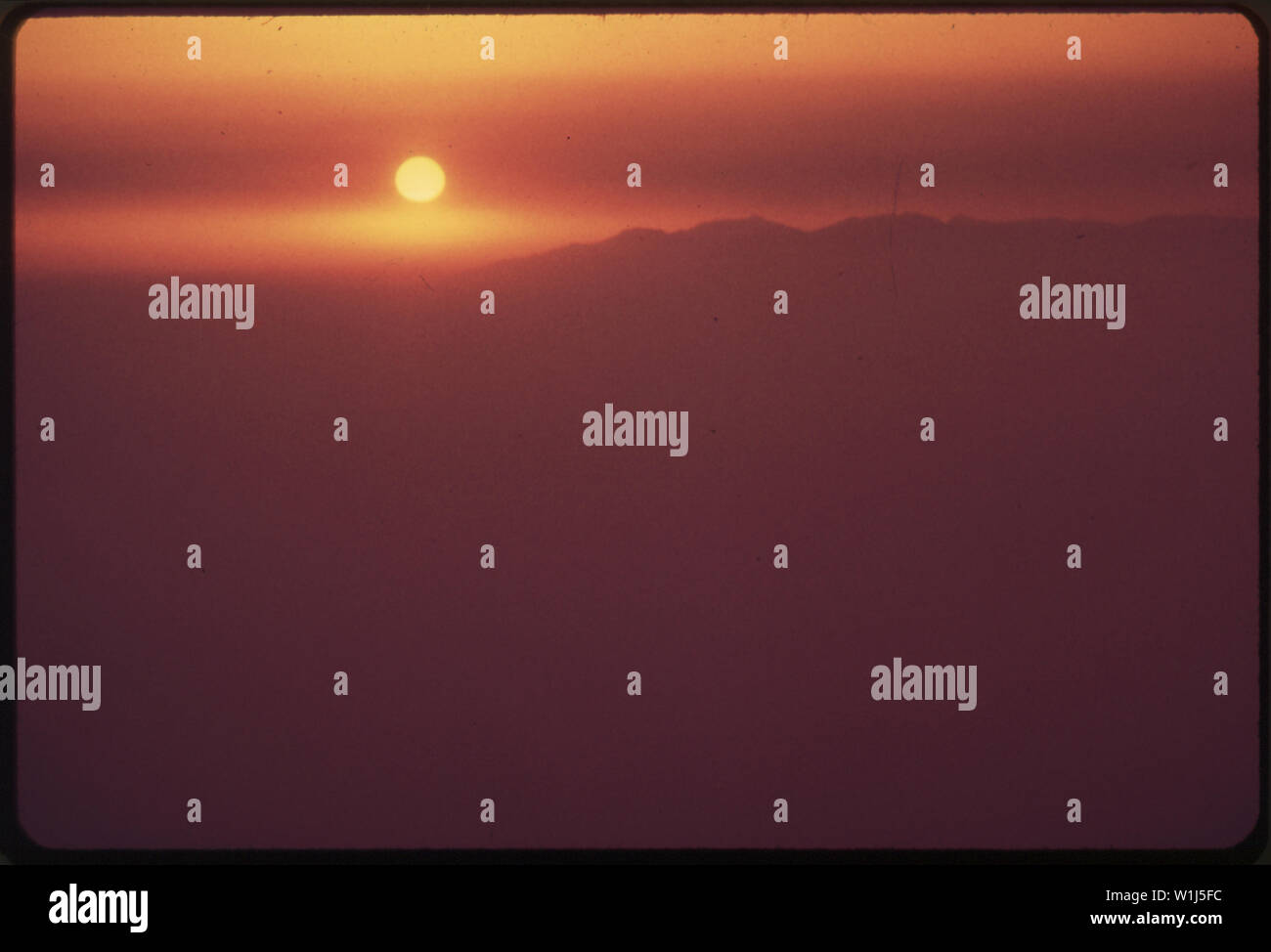 SUNSET SEEN THROUGH HEAVY SMOG Stock Photo - Alamy